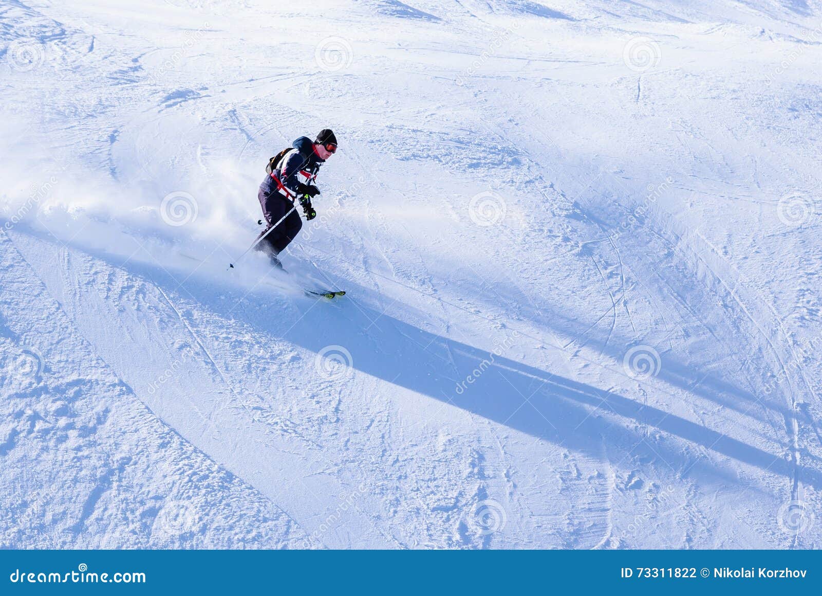 Skier on the slopes editorial photography. Image of desire - 73311822