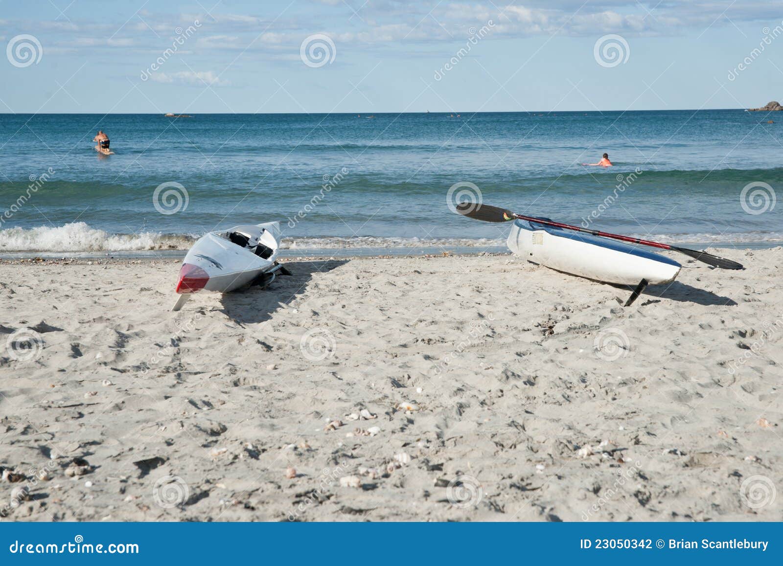 Skiffs on Beach with Surfers in Background. Editorial Photography ...