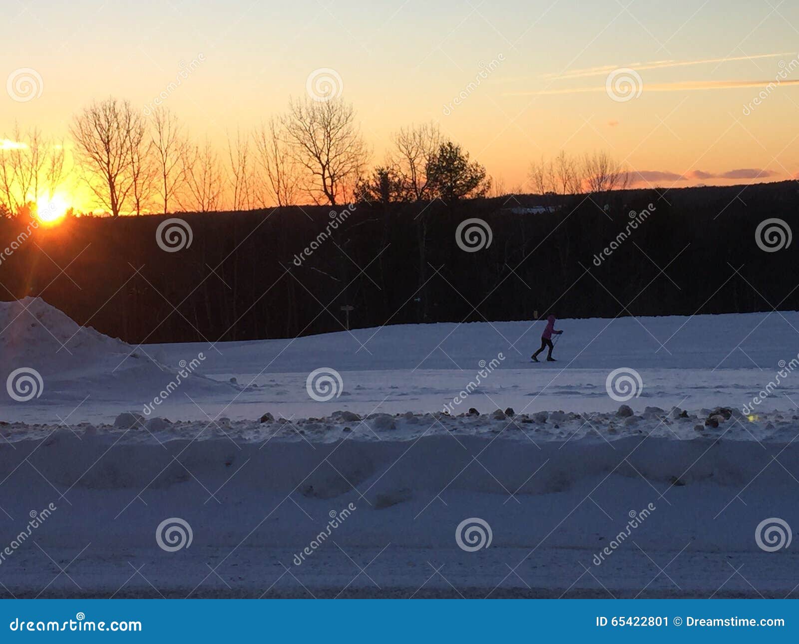 Skiing at sunset stock image. Image of glides, sunset - 65422801