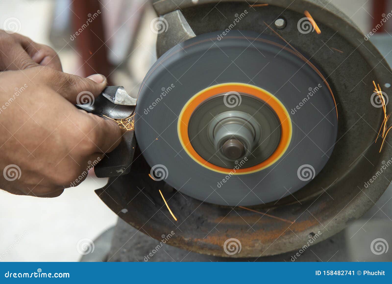 The Skill Operator Use Hand for Regrinding the Drill Tool with the ...