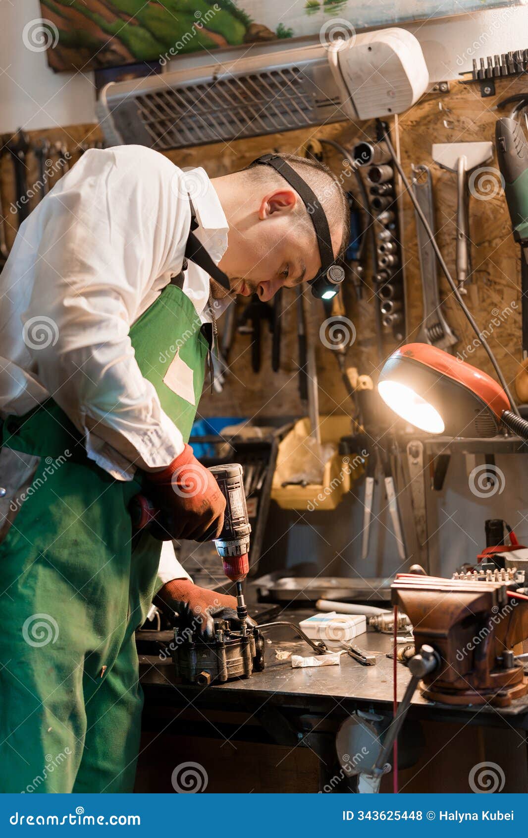 Skilled Craftsman Engaged in Precision Mechanical Work in a Well ...