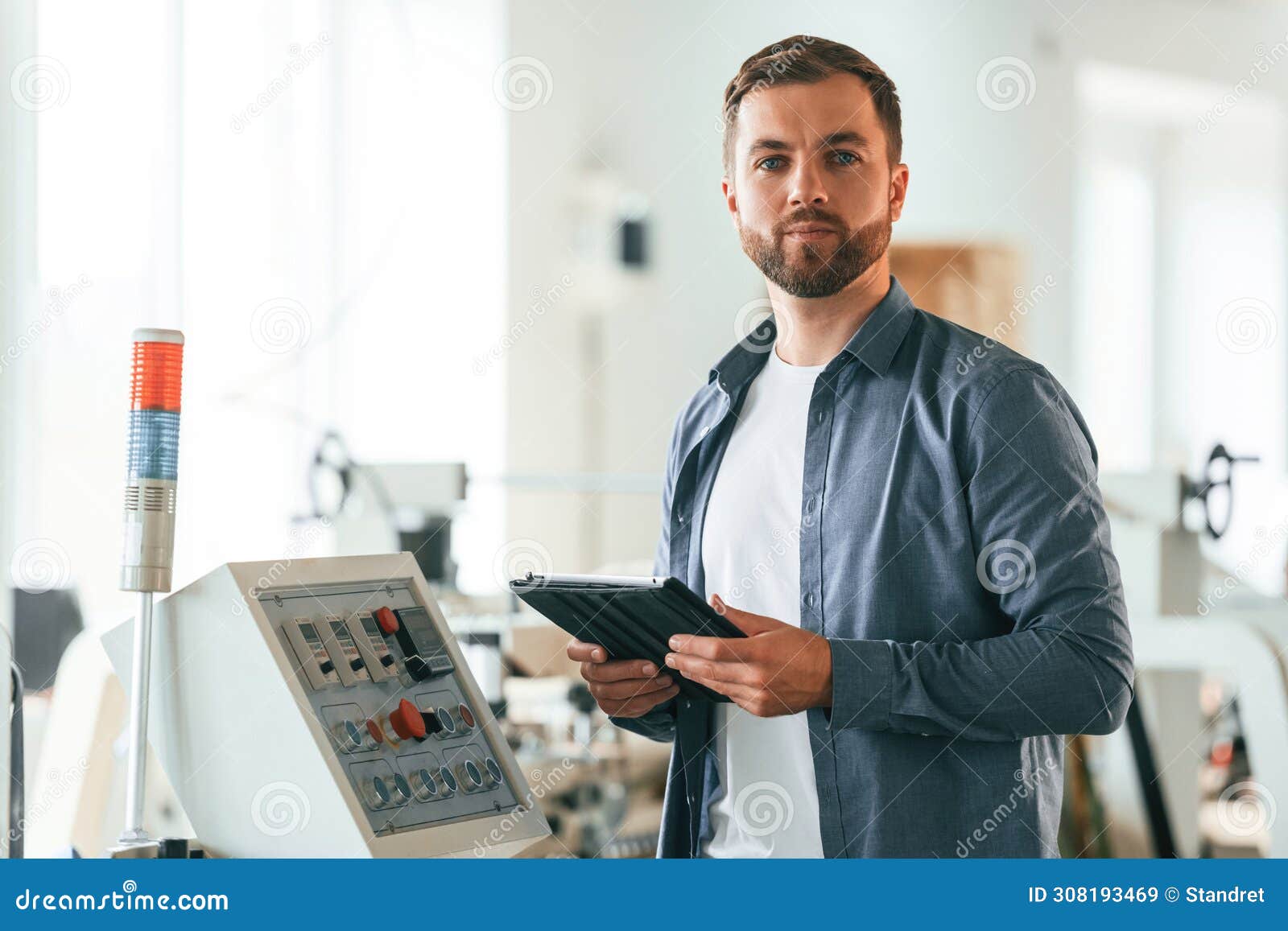 Skilled Engineer. Handsome Man is Working at the Factory of Creating ...