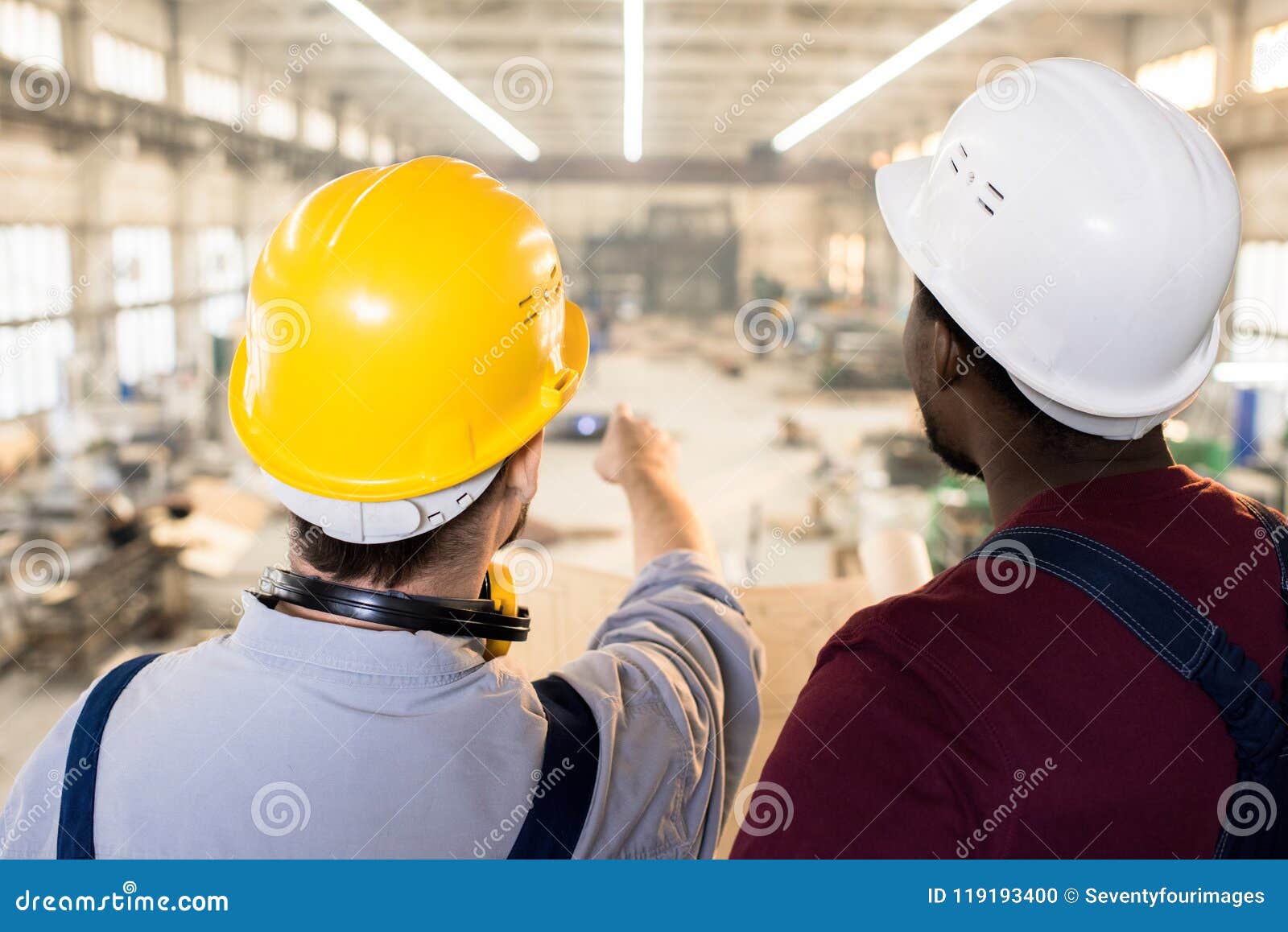 Skilled Engineers Visualizing Sketch at Construction Site Stock Photo ...