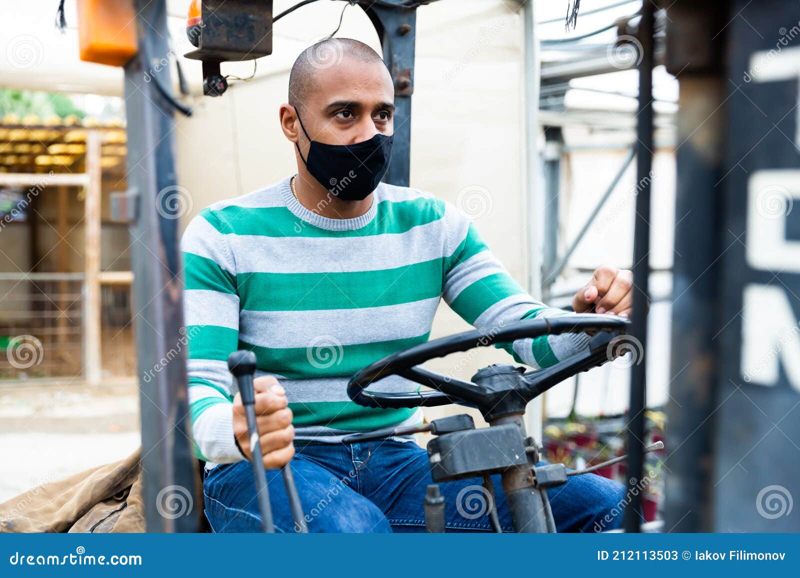 Skilled Worker in Protective Mask of Materials Warehouse Working on ...