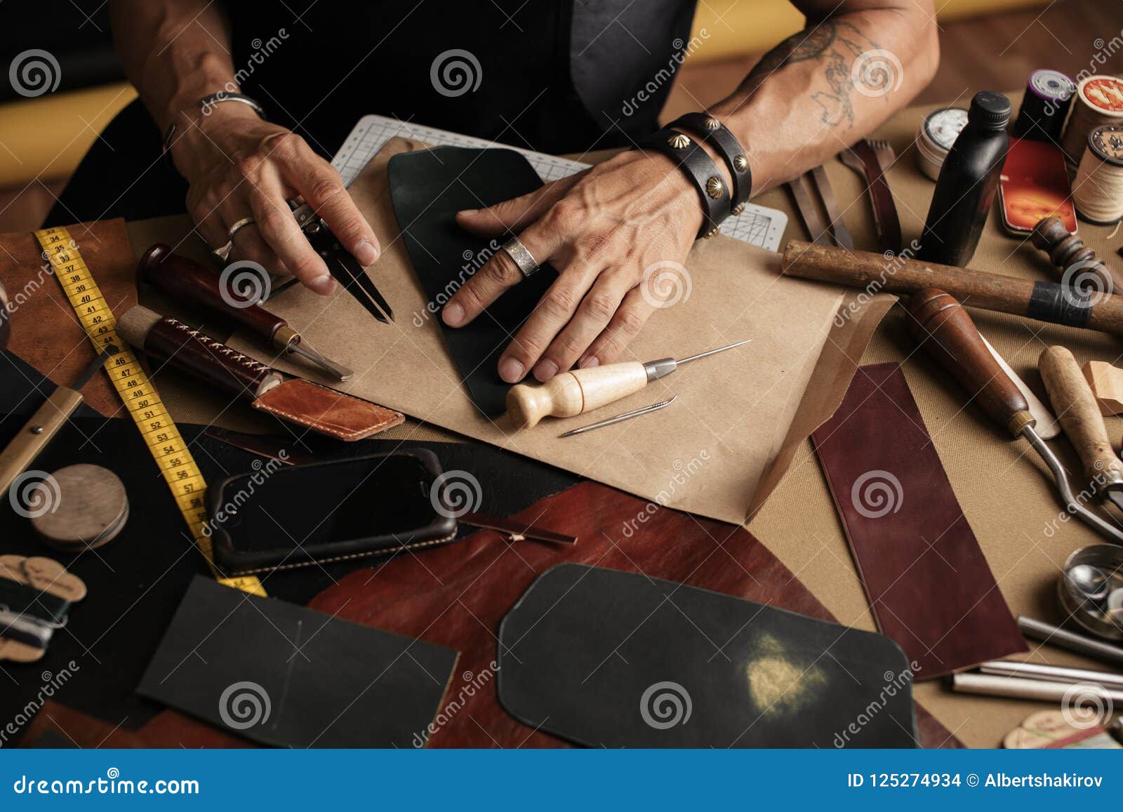 Close Up of a Shoemaker Working with Leather Textile and Hammer at a ...