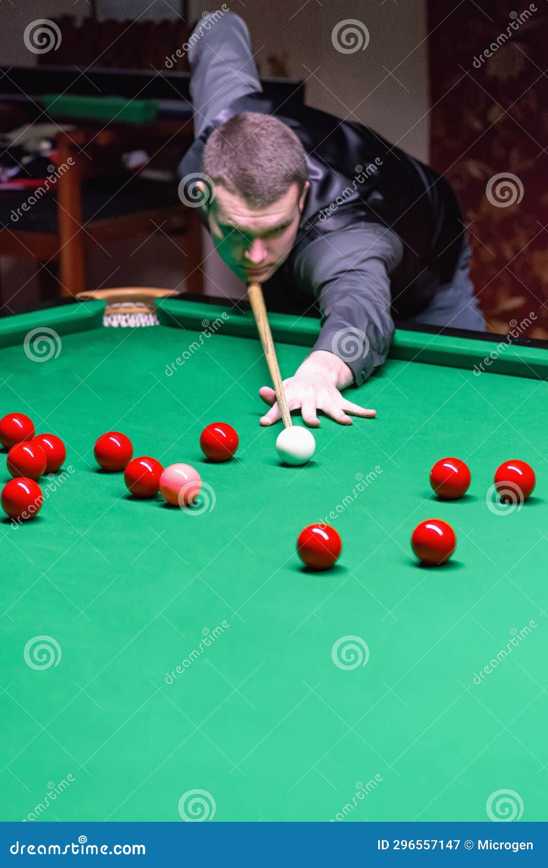 A Skilled Snooker Player Engaged in a Captivating Game of Precision and ...