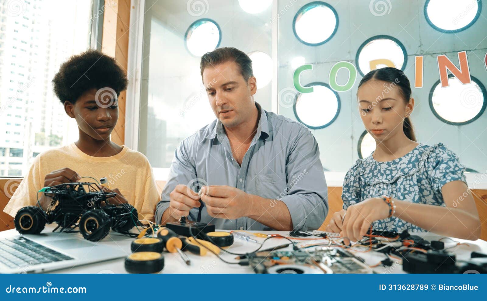 Teacher Teaching Diverse Students Fixing Car Model by Using Wire ...