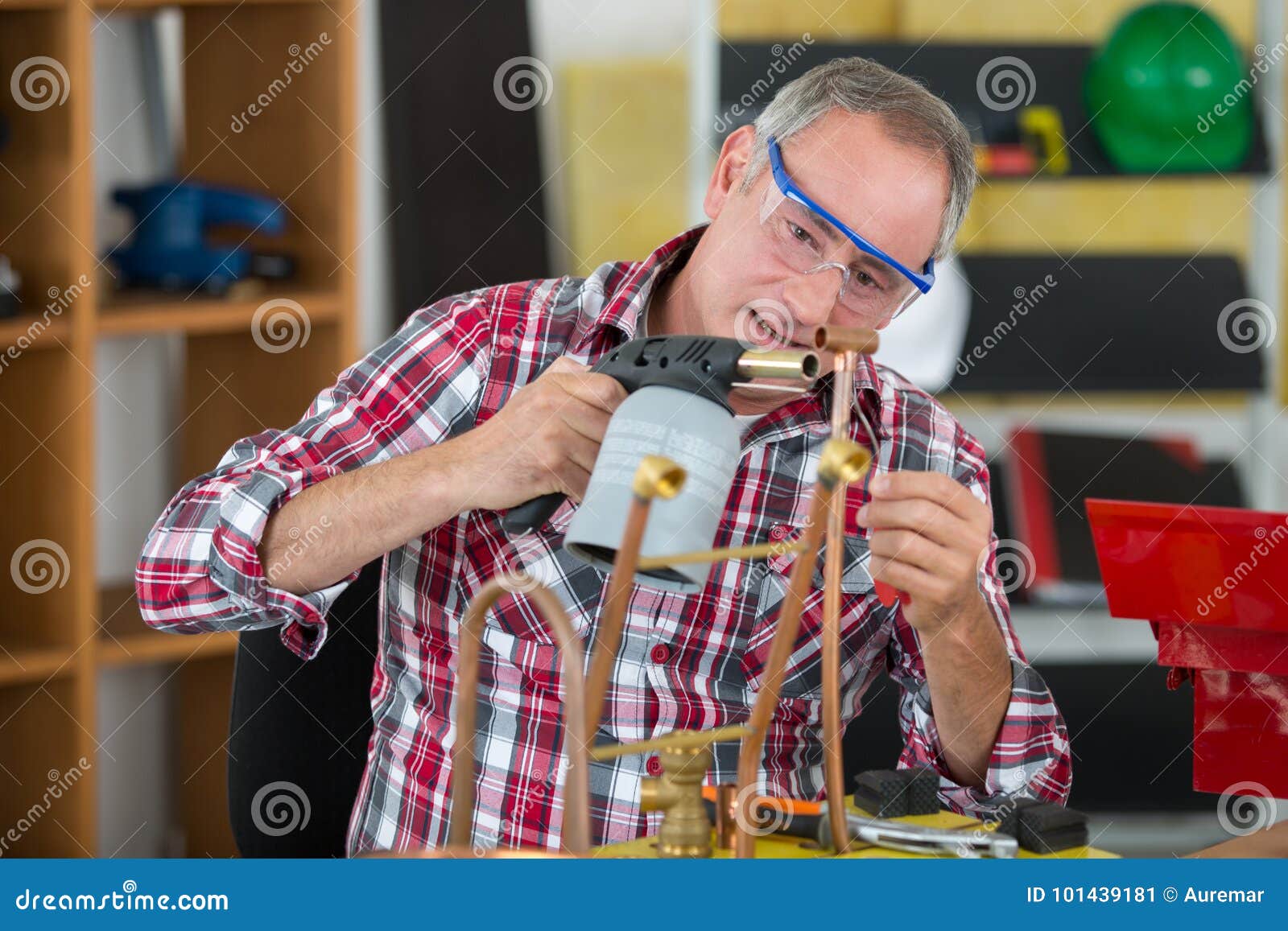 Skilled Tradesman Soldering Copper Pipe Stock Image - Image of helmet ...