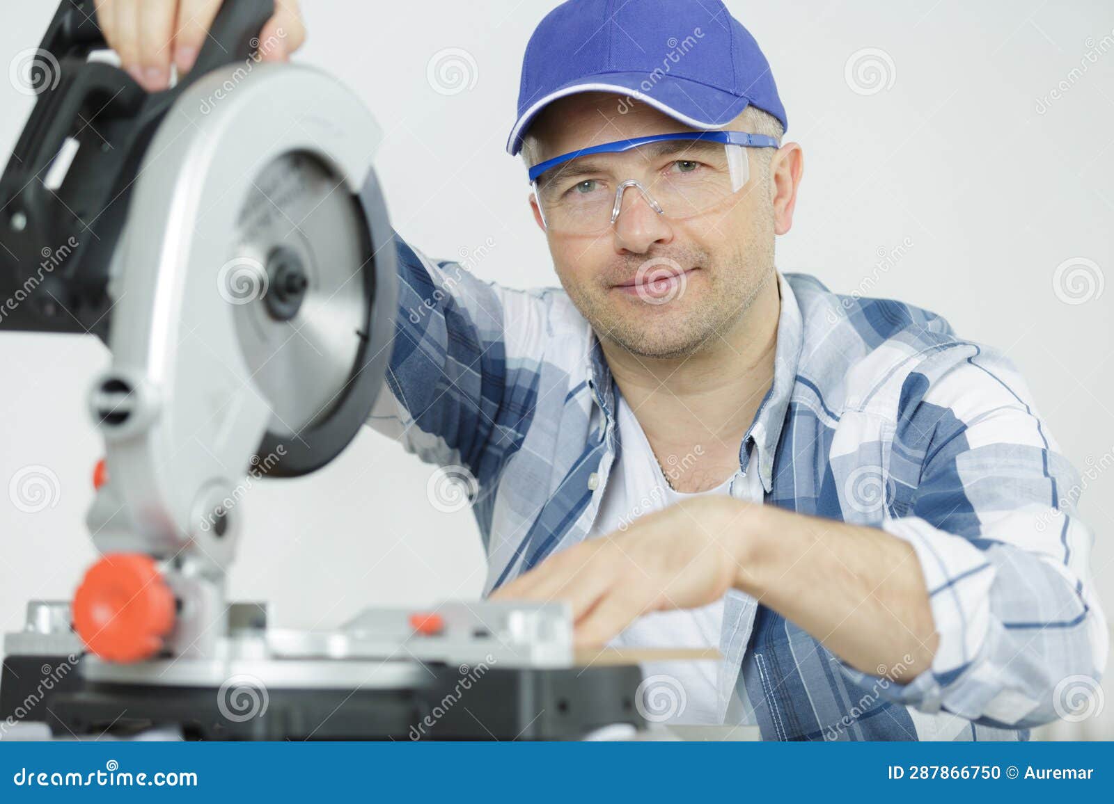 Skilled Woodworker Wearing Safety Gear Using Saw Stock Photo - Image of ...