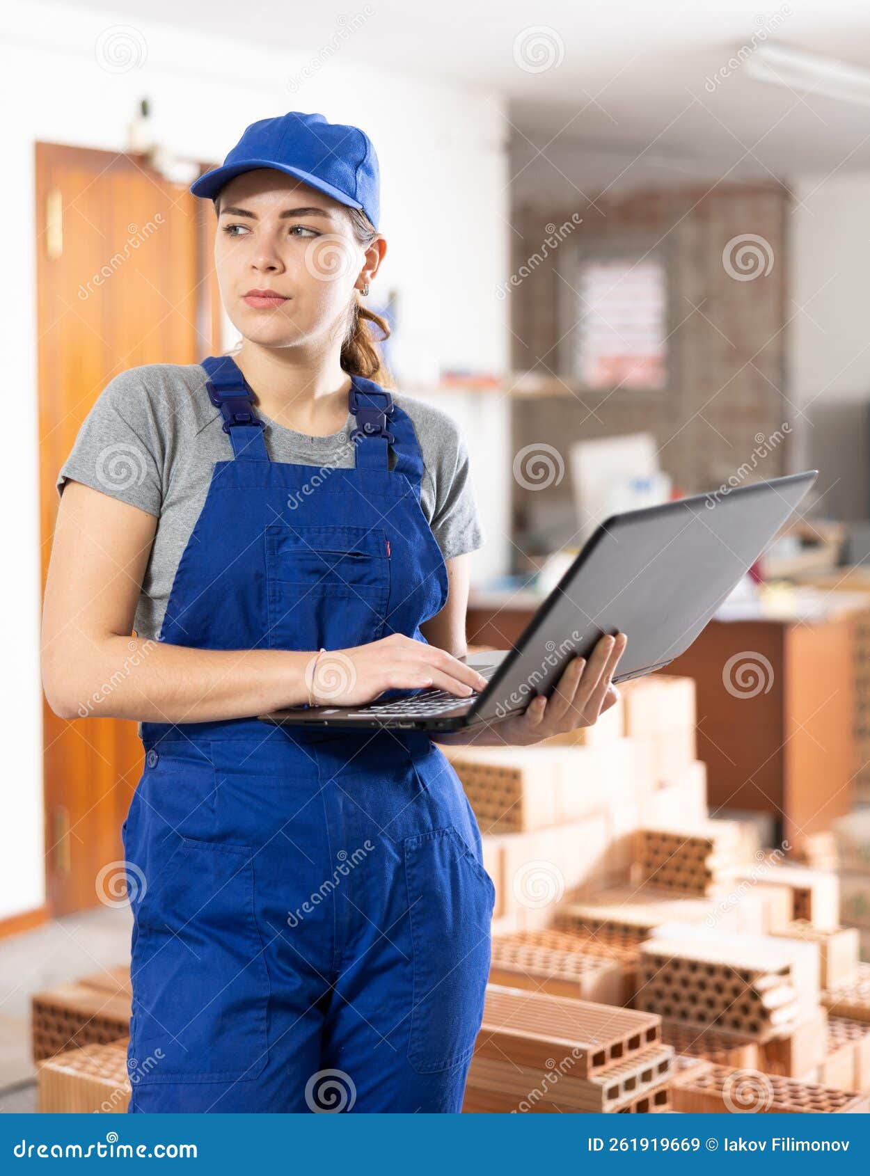 Female Foreman Working with Laptop in Building Under Construction Stock ...