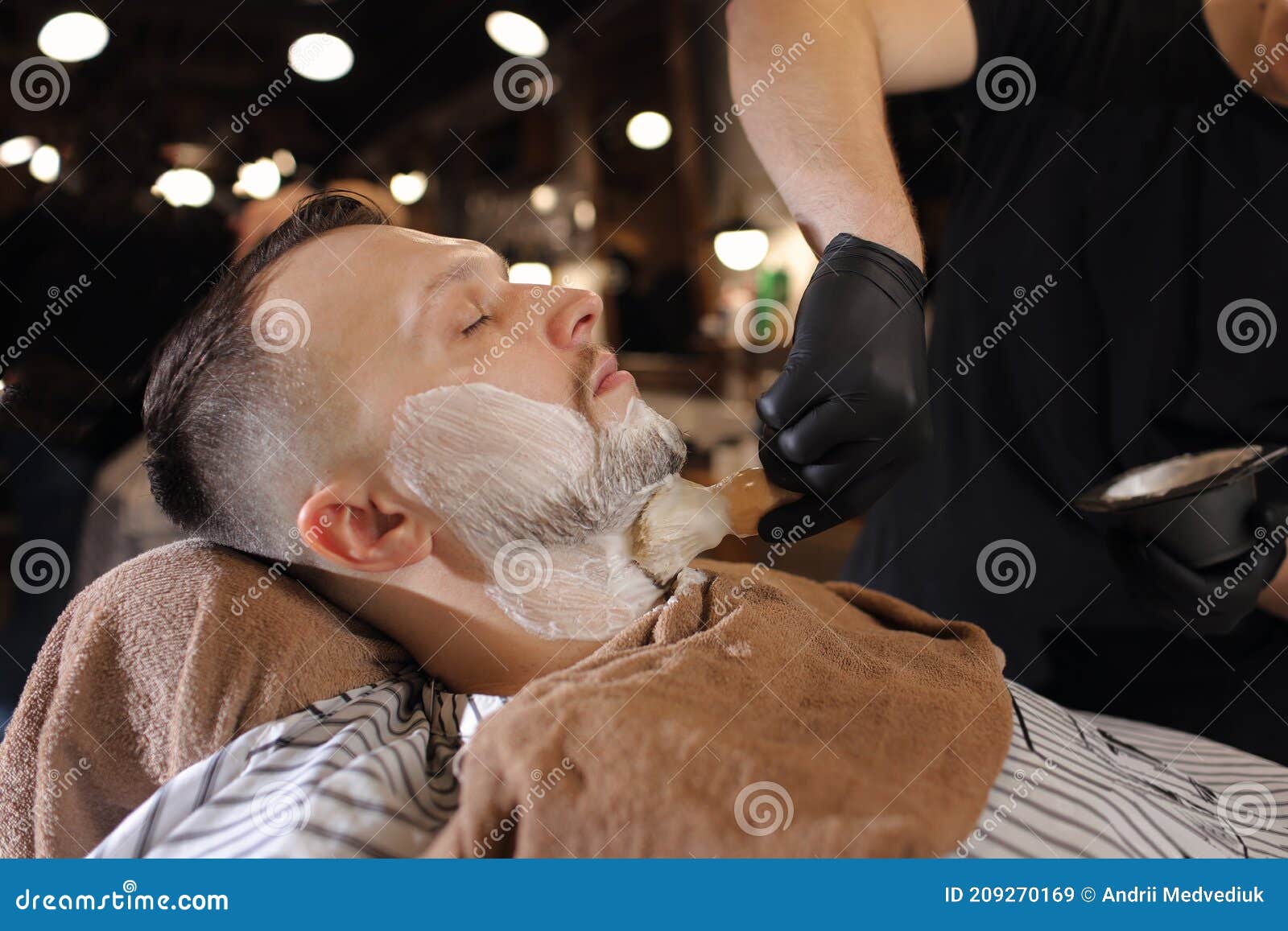 Skillful Barber. Young Man Getting an Old-fashioned Shave with Straight ...