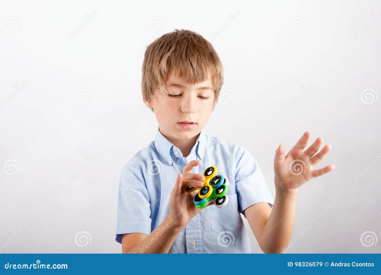 Skillful Boy Showing Fidgeting Tricks with Four Fidget Spinners Stock ...