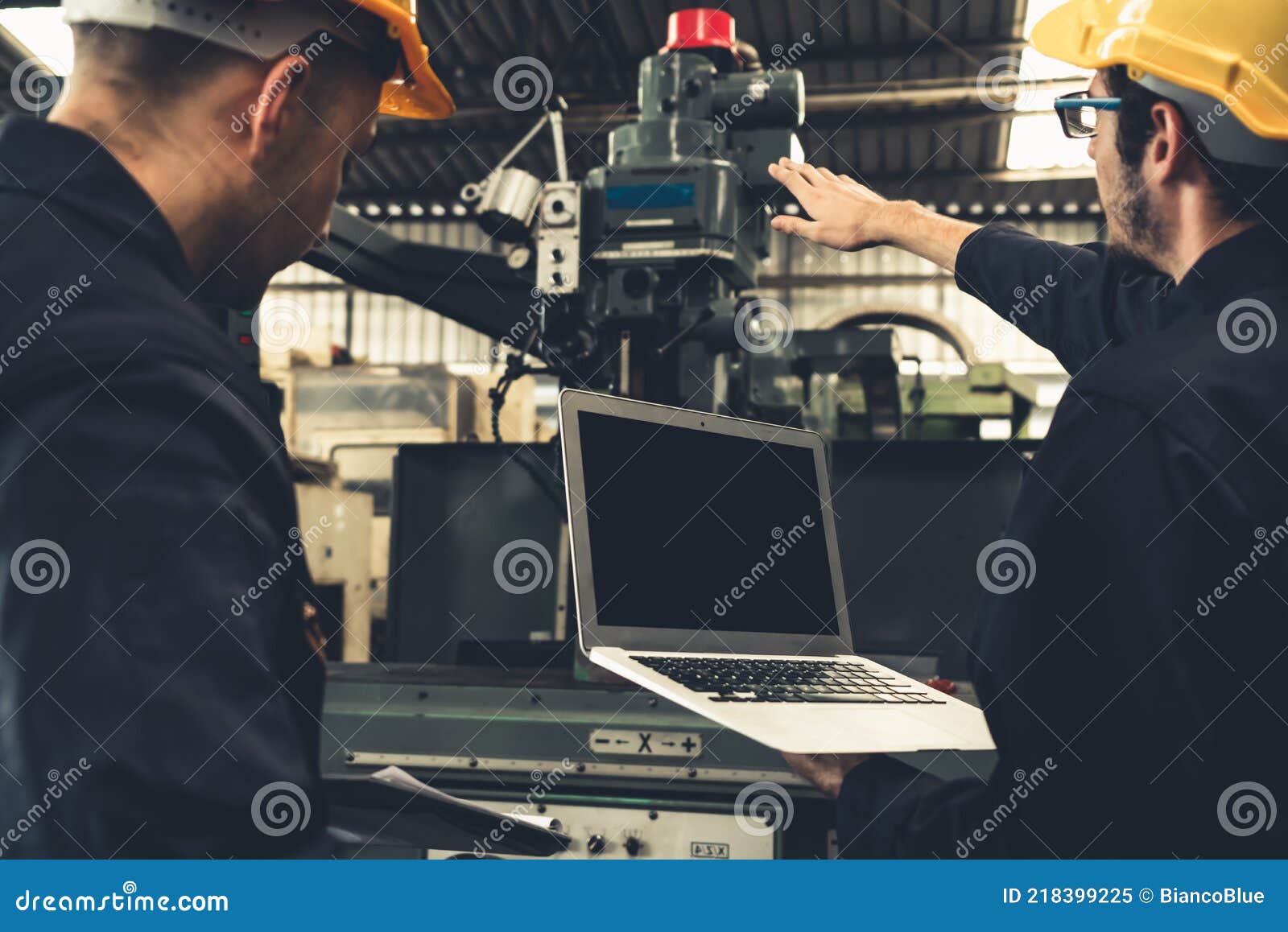 Skillful Factory Worker Working with Laptop Computer To Do Procedure ...