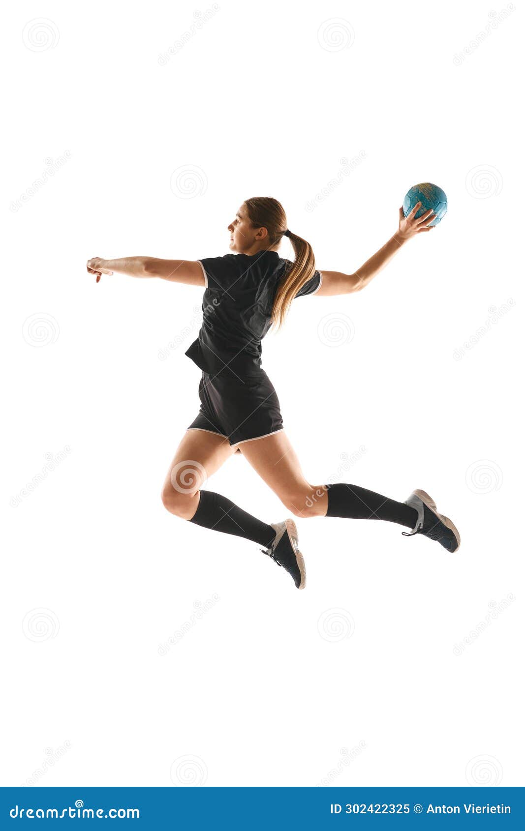 Skillful Handball Player Demonstrating Precision and Strength in ...