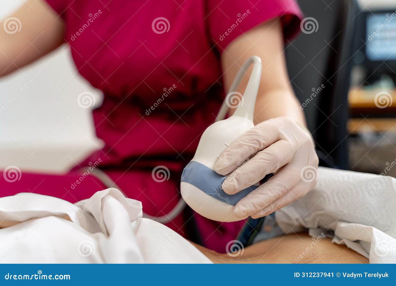 Skillful Sonographer Using Ultrasound Machine at Work. Selective Focus ...