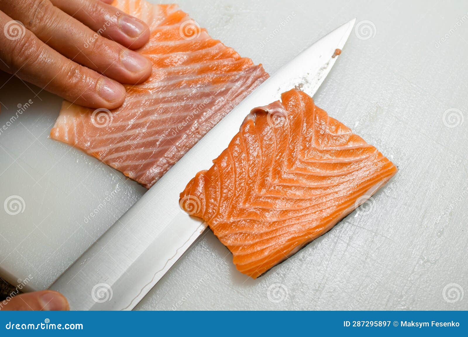 Skillfull Chef Masterfully Cuts Fresh Salmon Fillet with Sharp Knife on ...