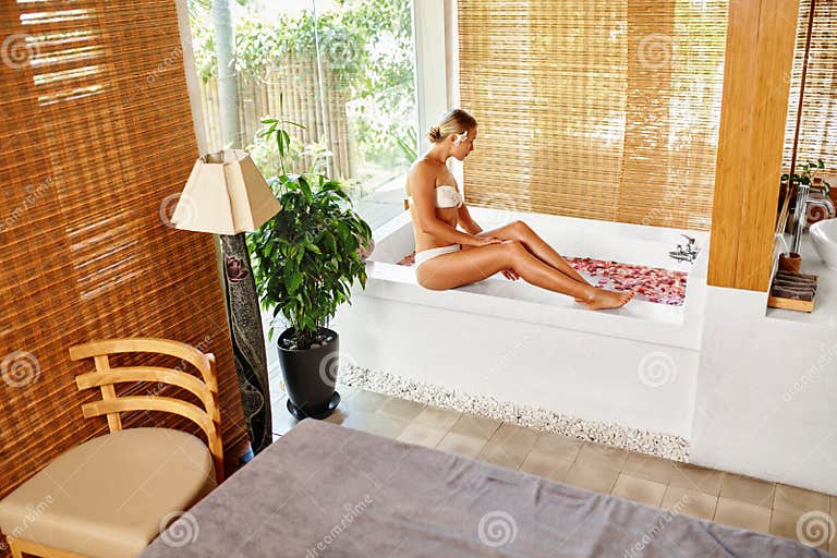 Skin Care Spa Treatment Woman On Bathtub Flower Rose Bath Stock