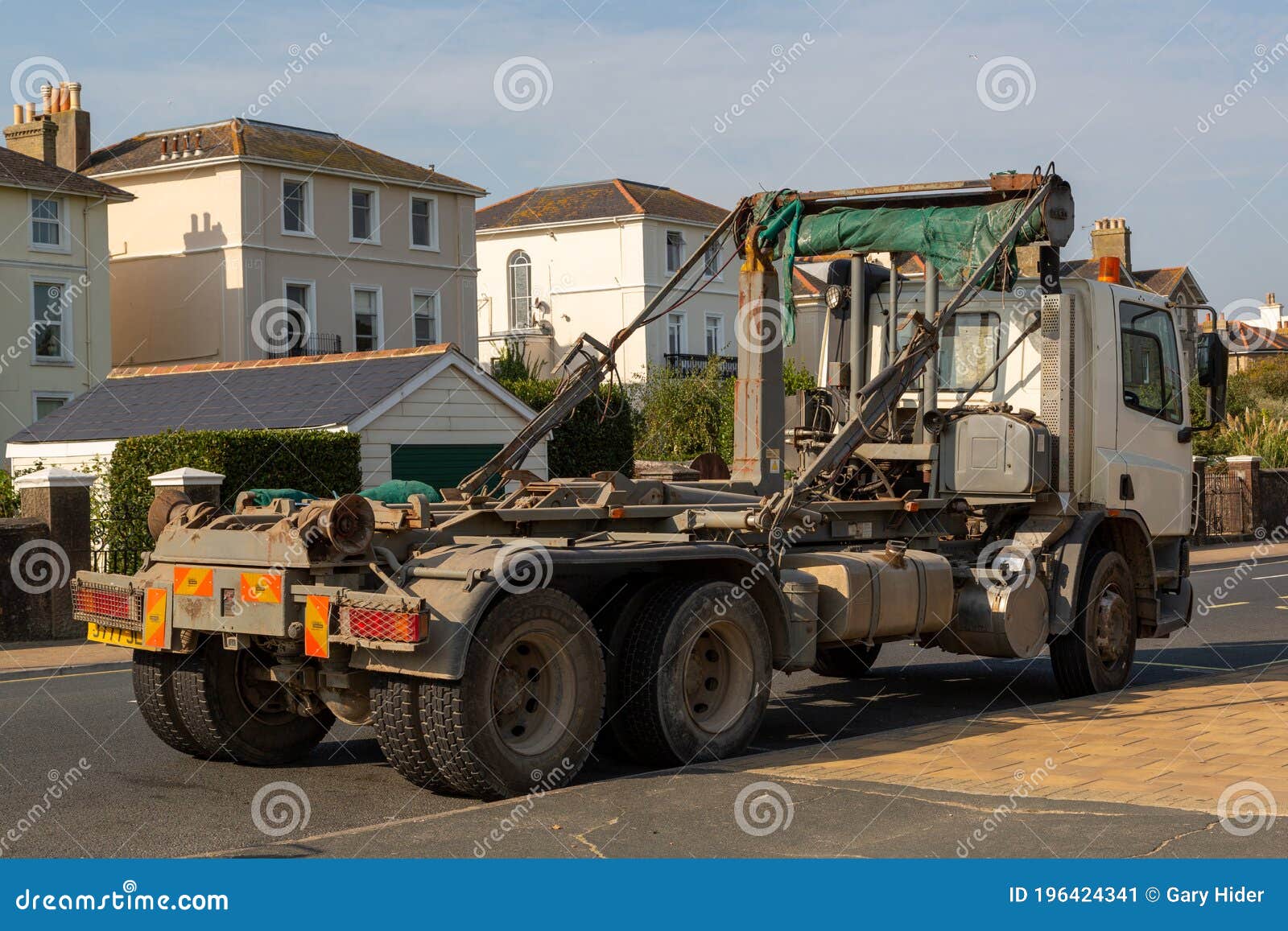 A Skip Carrier Lorry Parked on the Side of the Road Editorial Photo ...