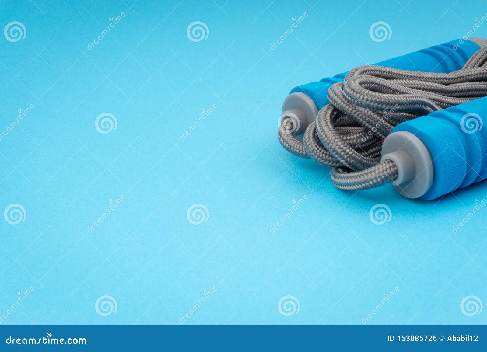 Skipping Rope or Jumping Rope Isolated on Blue Background Stock Photo ...