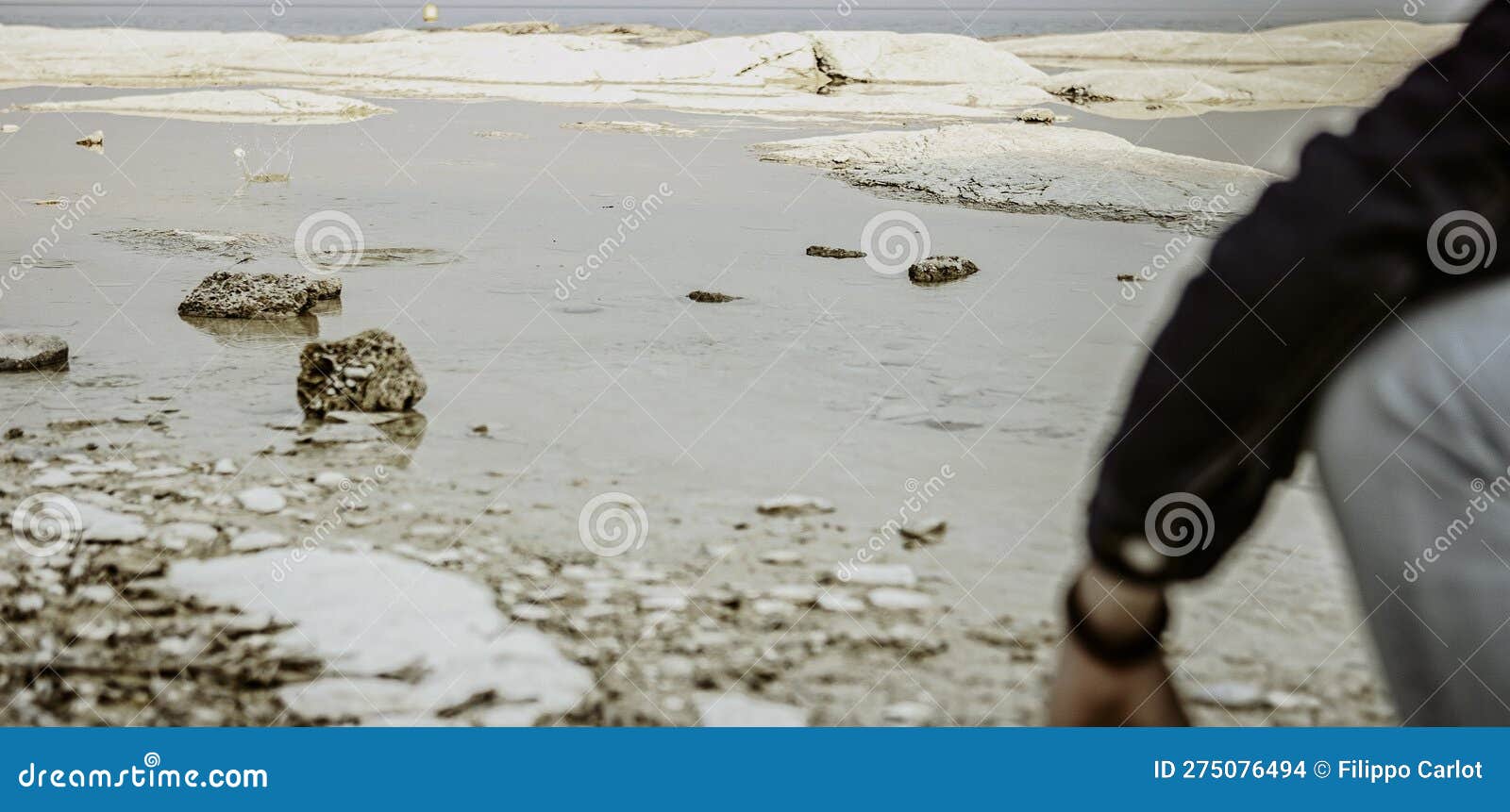 Skipping Stone: Boy Skips Stone Across Water Stock Photo - Image of ...