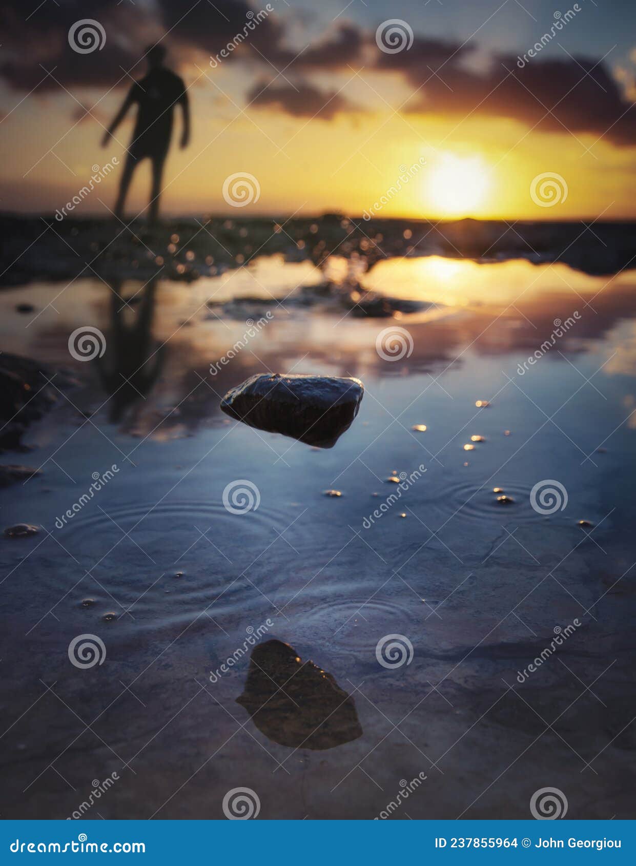 Skipping Stones. Silhouette Stock Photo - Image of creative, clouds ...
