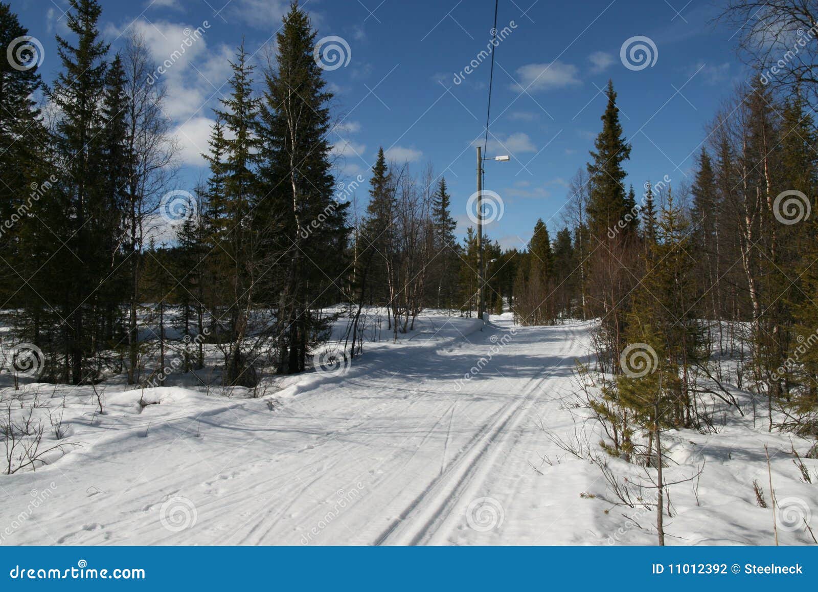 Skitrack in early spring stock photo. Image of lightpost - 11012392