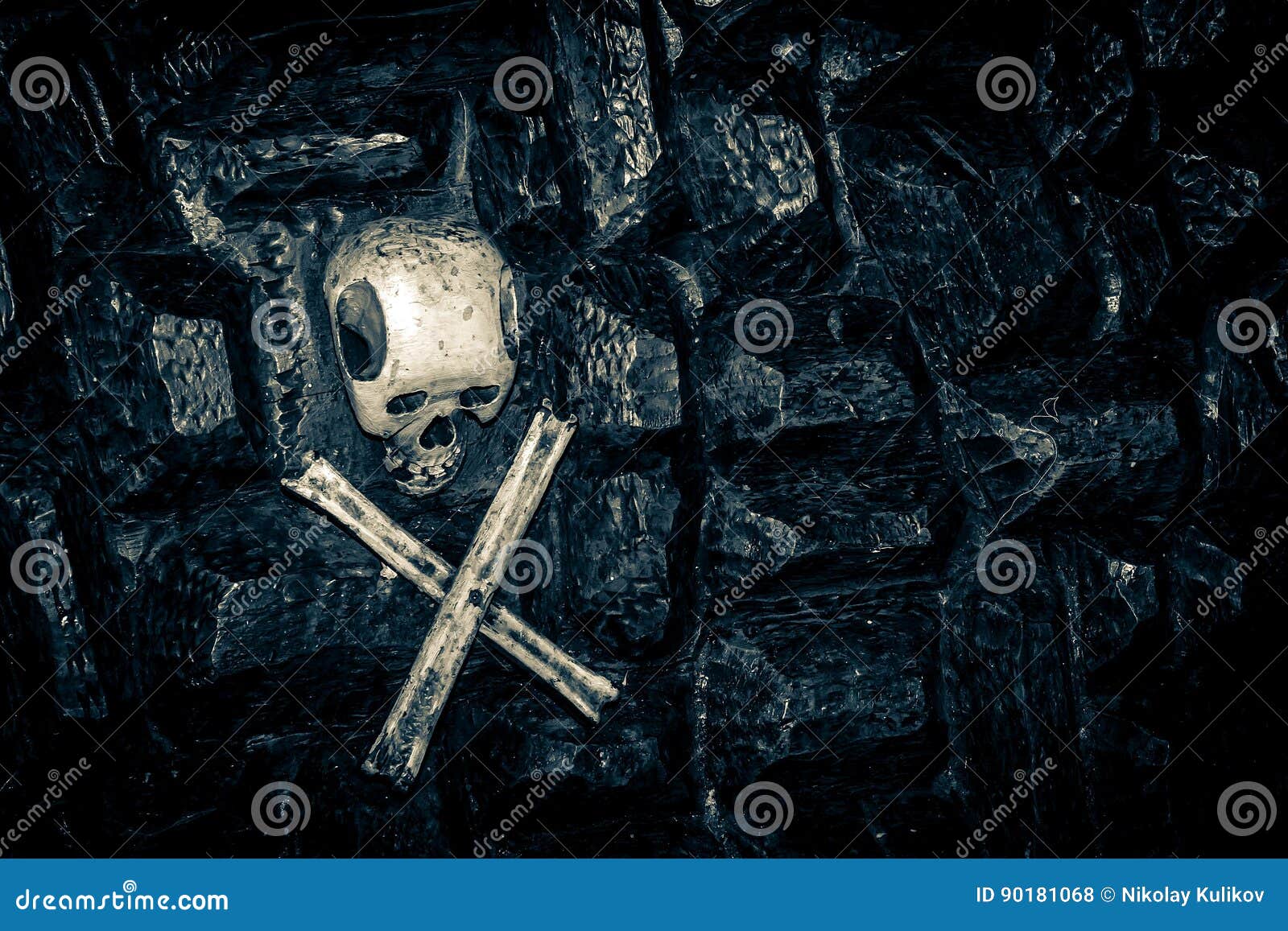 Skull and Crossbones Hanging on a Dark Rock Stock Photo - Image of ...