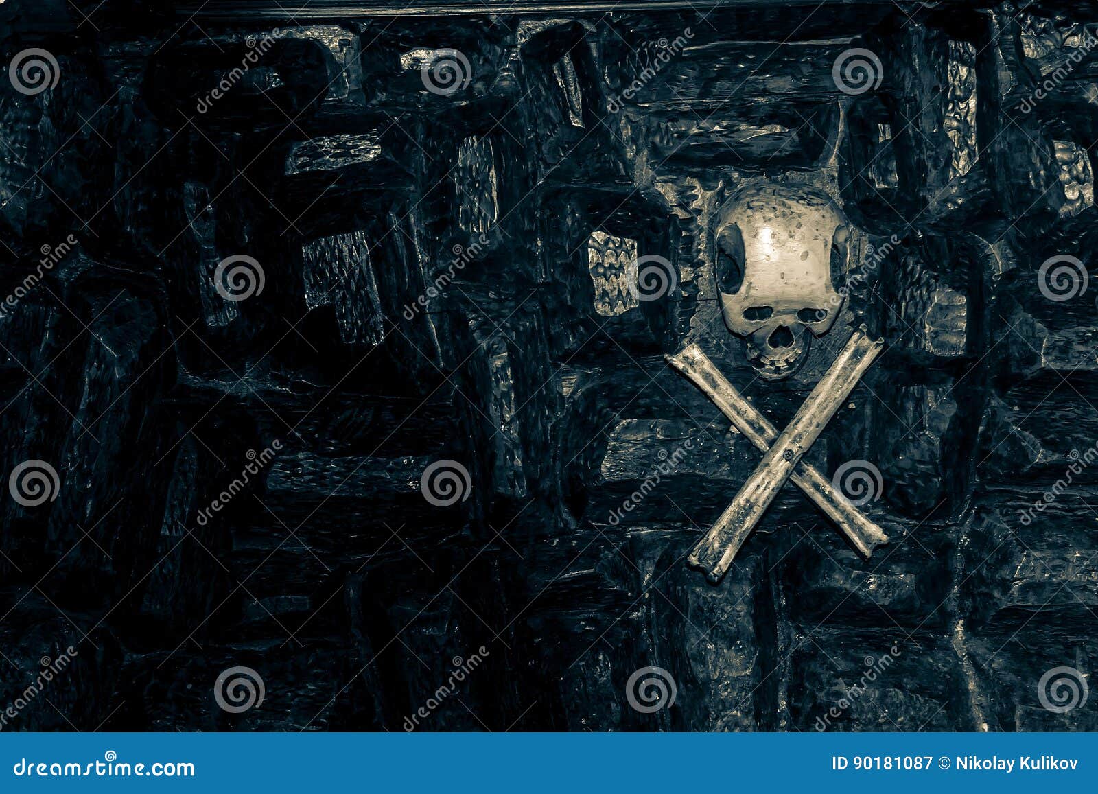 Skull and Crossbones Hanging on a Dark Rock Stock Image - Image of ...