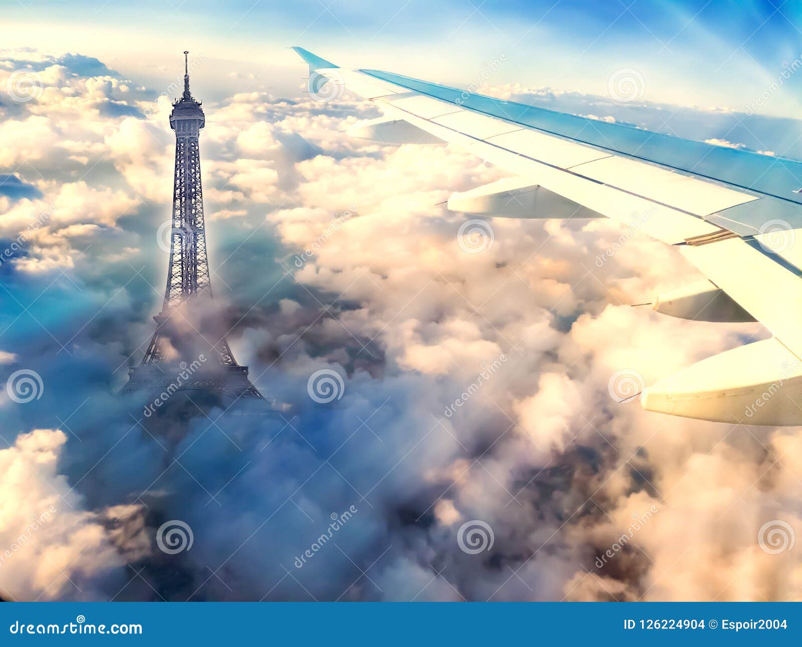 Eiffel Tower in the Sun Under the Wing of a Flying Plane Stock Photo ...