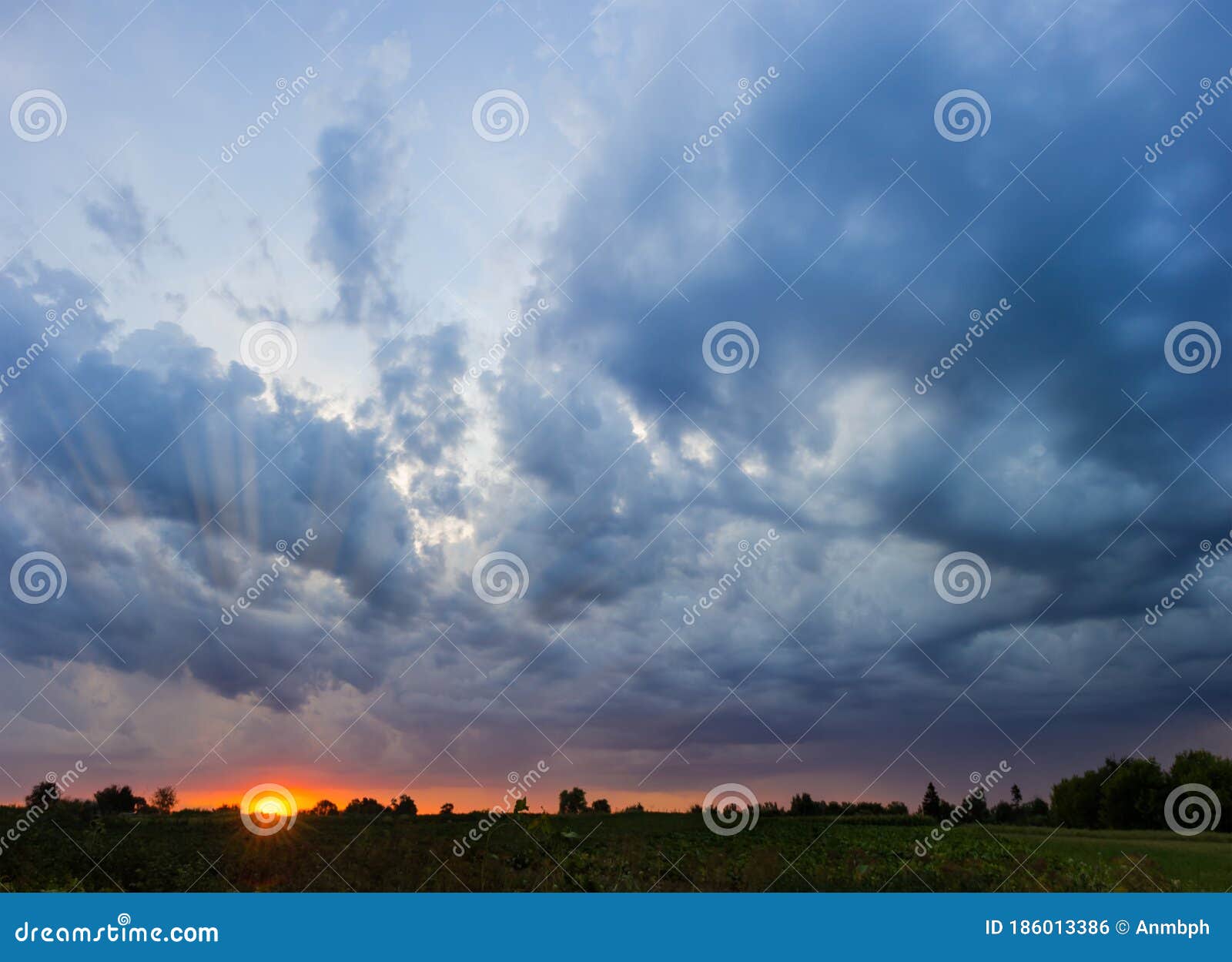Sky with Clouds and Sun Over the Field at Sunset Stock Photo - Image of ...
