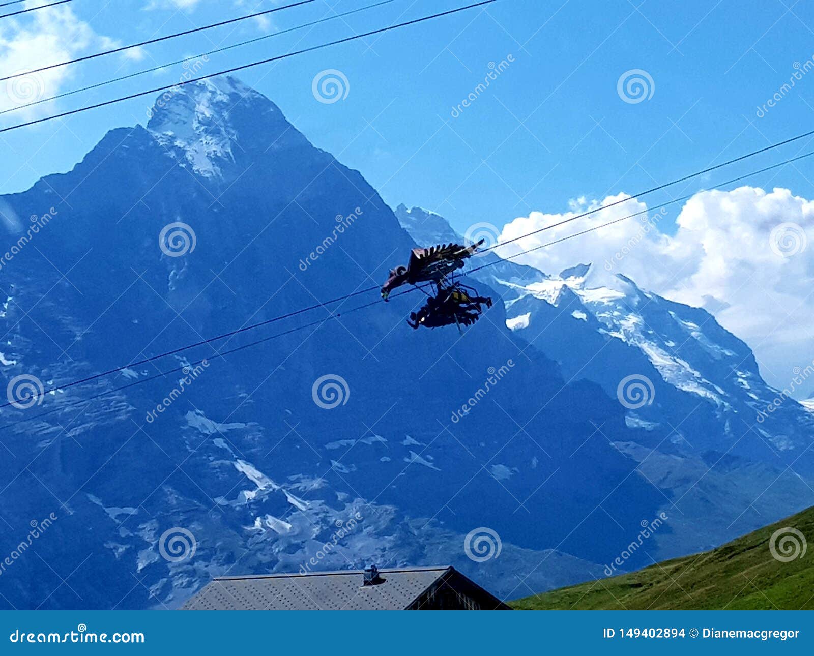 Sky flying in the alps stock photo. Image of alps, wire - 149402894