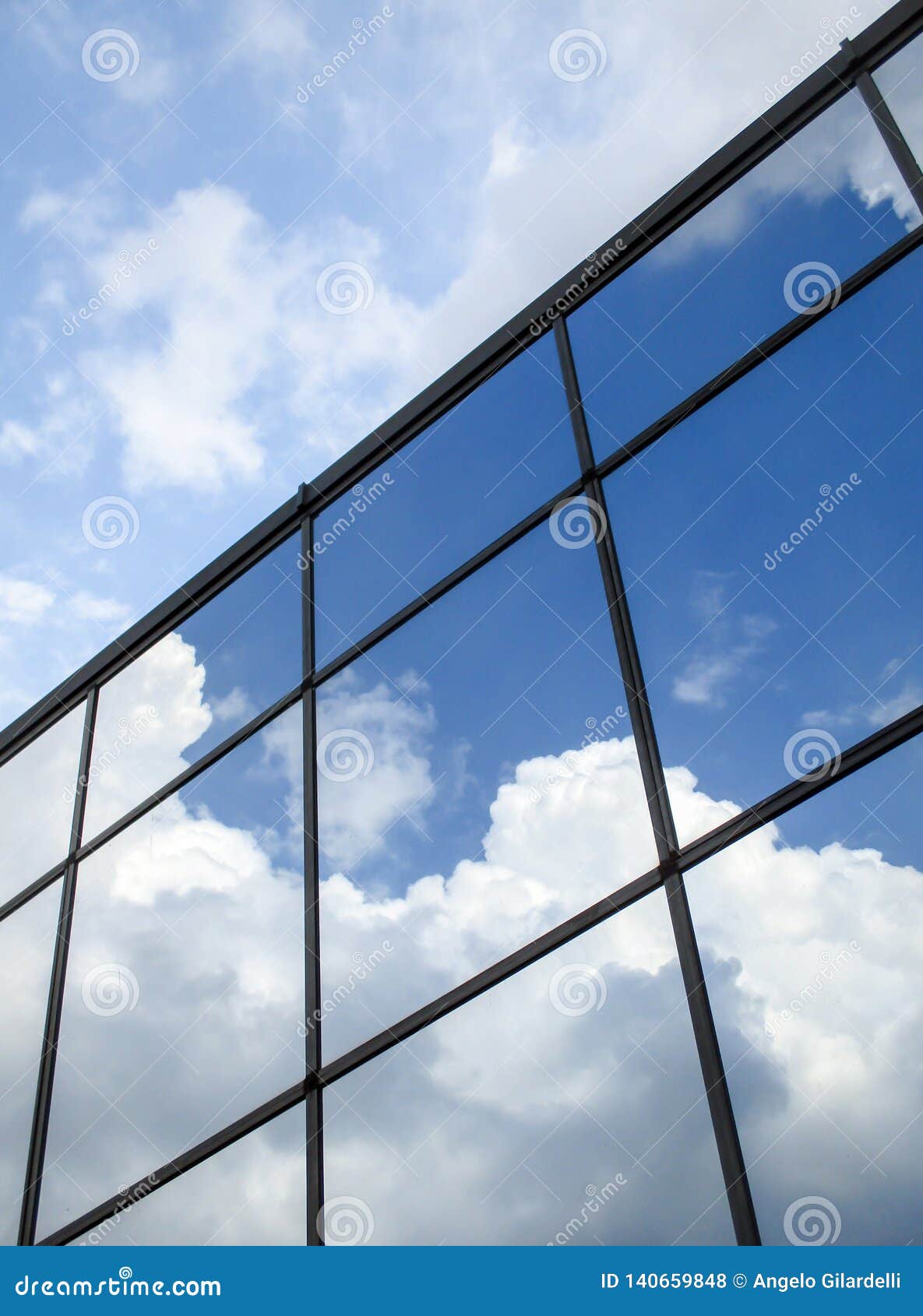 Sky mirrored in windows stock photo. Image of background - 140659848