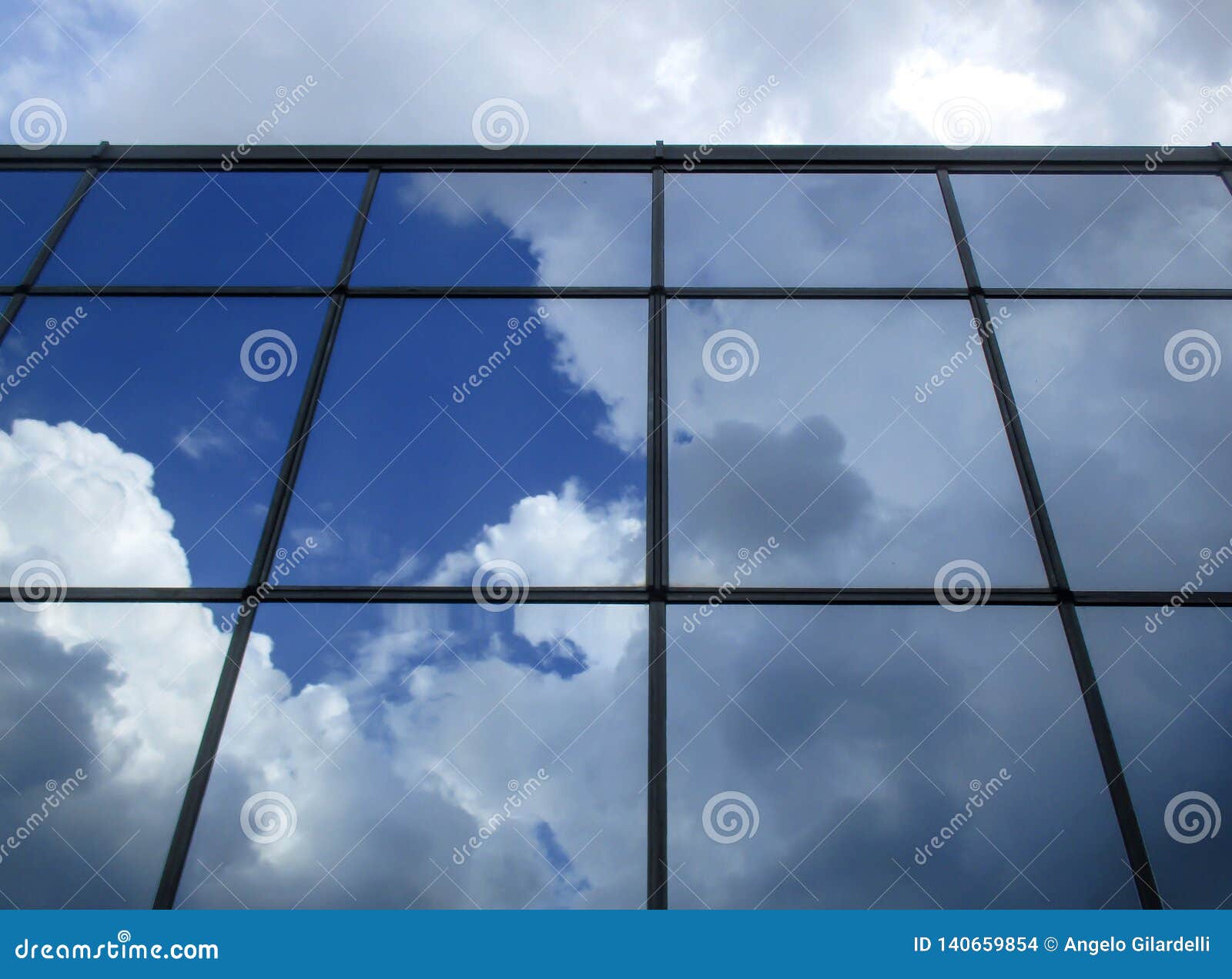Sky mirrored in windows stock photo. Image of blue, glass - 140659854