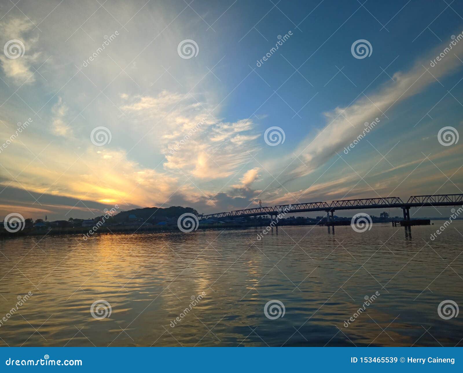 The Sky when the Sun Will Rise in the River with the Bridge Stock Image ...