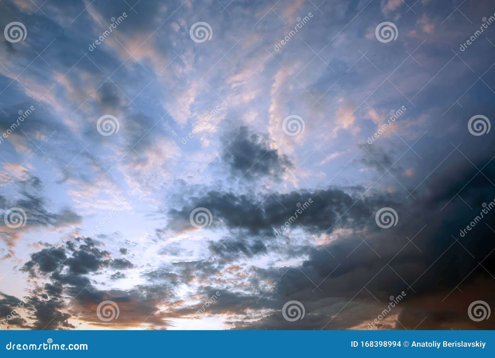 The Sky at Sunset. Cumulus Clouds Lit by the Rays of the Setting Sun ...