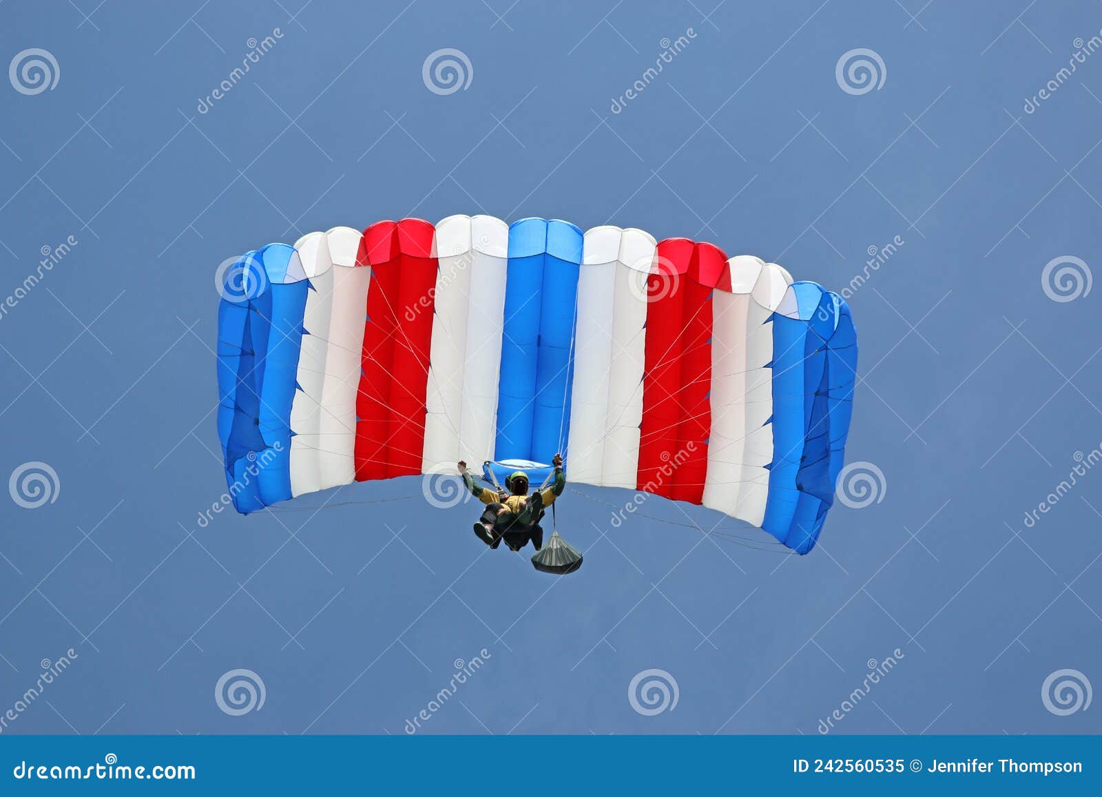 Skydiver in a blue sky stock image. Image of gliding - 242560535
