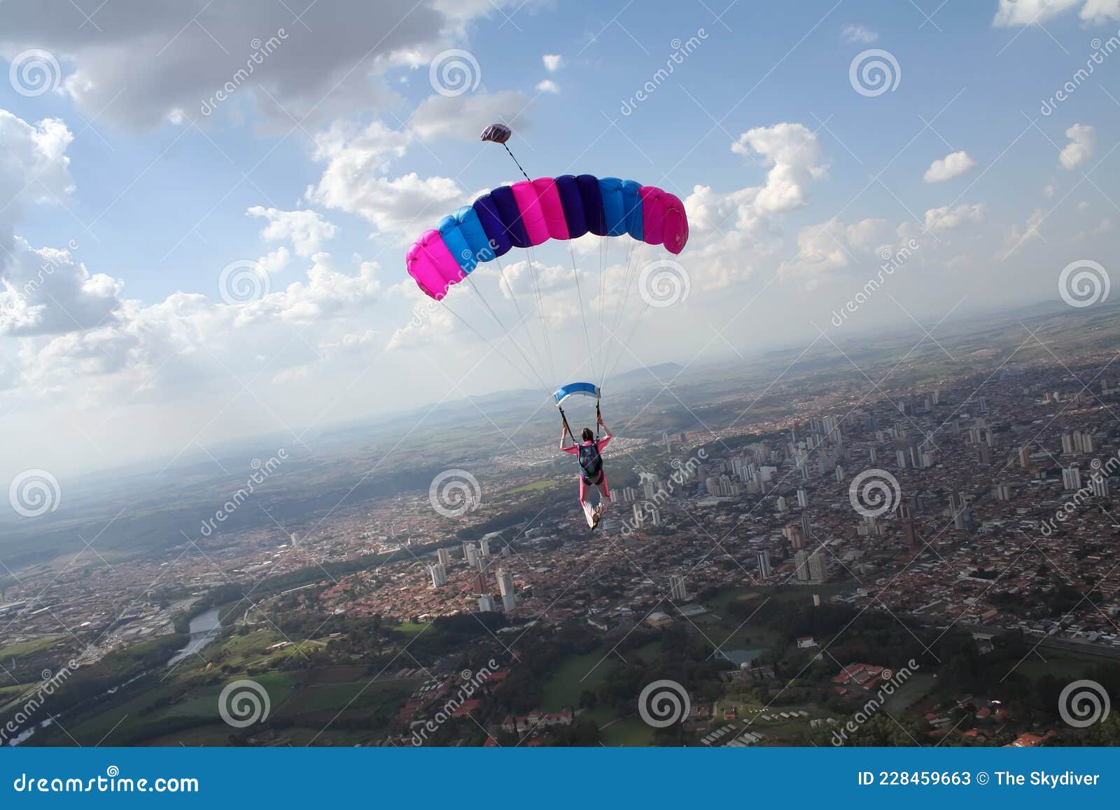 Skydiver Landing Her Parachute on the Ground. Stock Image - Image of ...