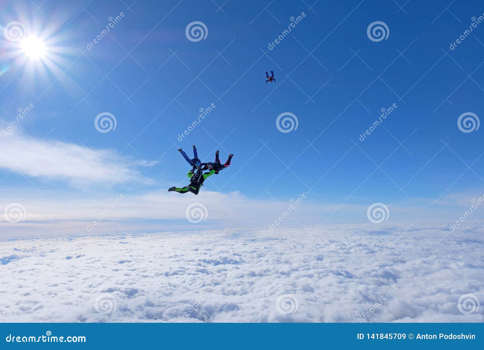 Formation Skydiving. Skydivers are in the Blue Sky. Editorial Stock ...