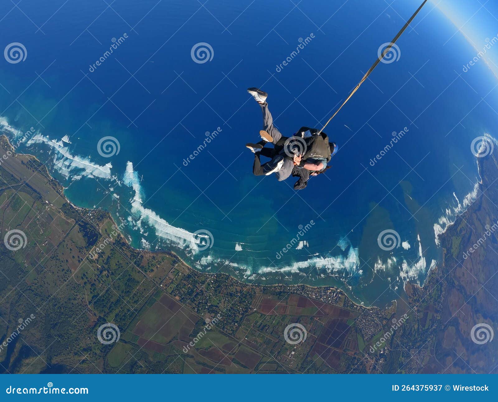 Skydiving above the ocean stock image. Image of airborne - 264375937
