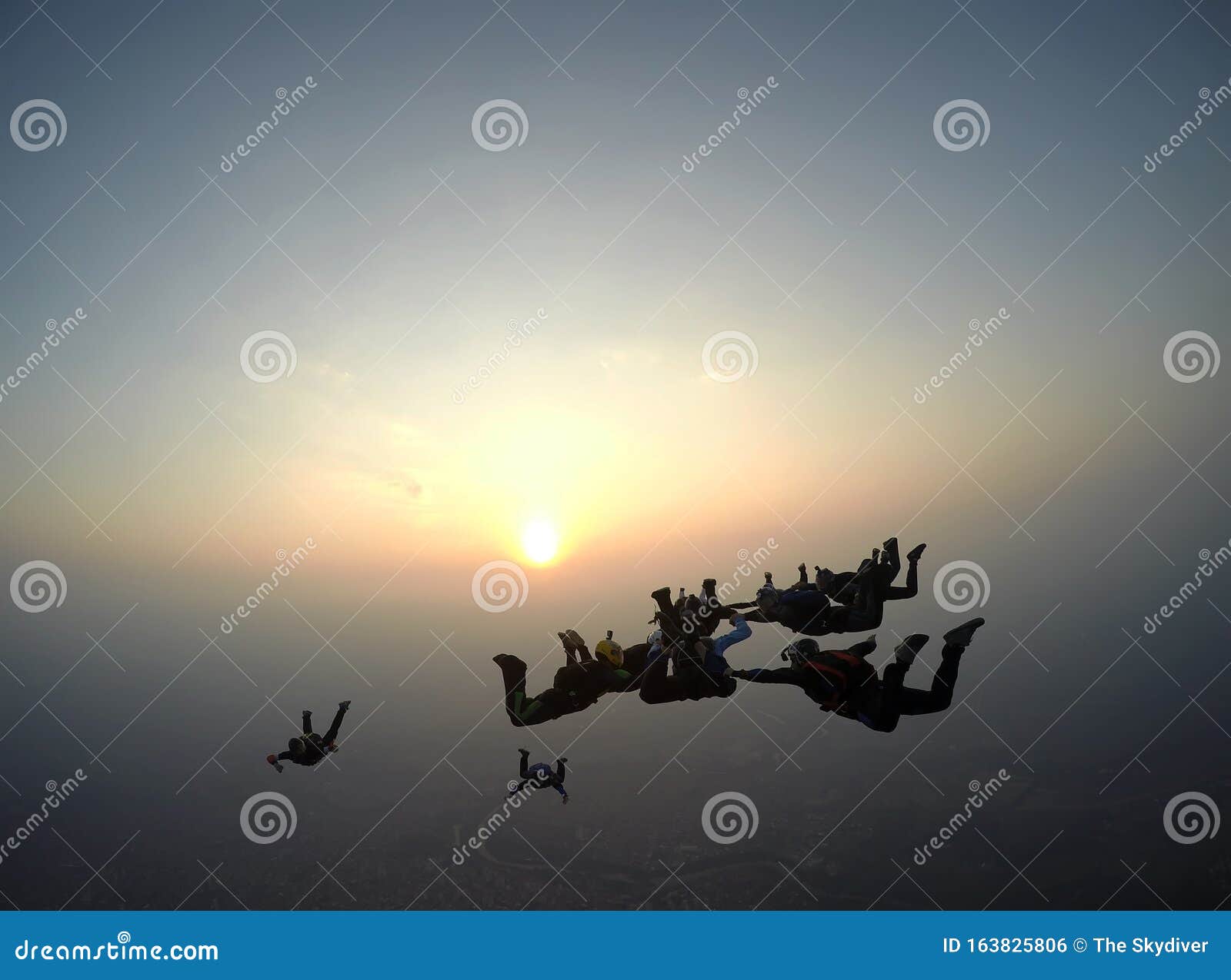 A Group of Skydivers Perform a Jump at Sunset. Editorial Photo - Image ...
