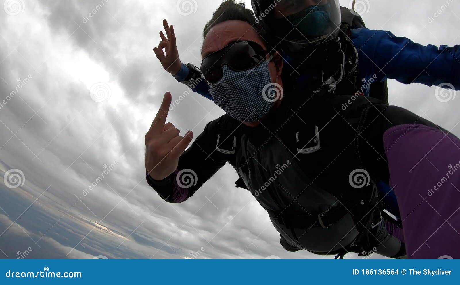 Skydiving Tandem with Protective Mask after the Lockdown Stock Footage ...
