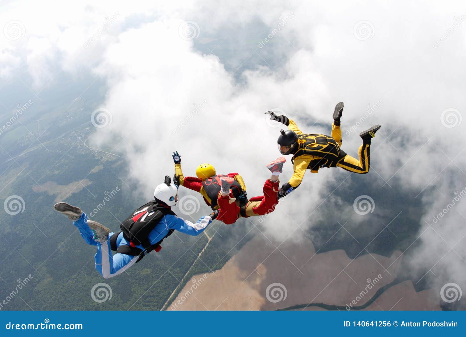 Skydiving. Two Instructors are Training a Student To Fly. Stock Photo ...