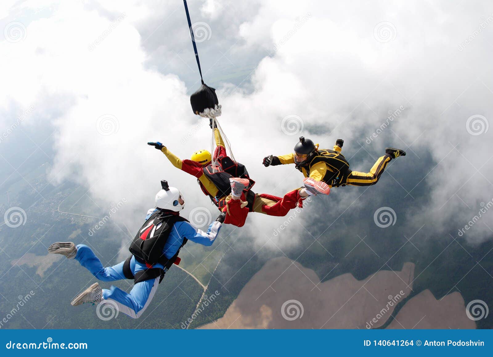 Skydiving. Two Instructors are Training a Student To Fly. Stock Photo ...