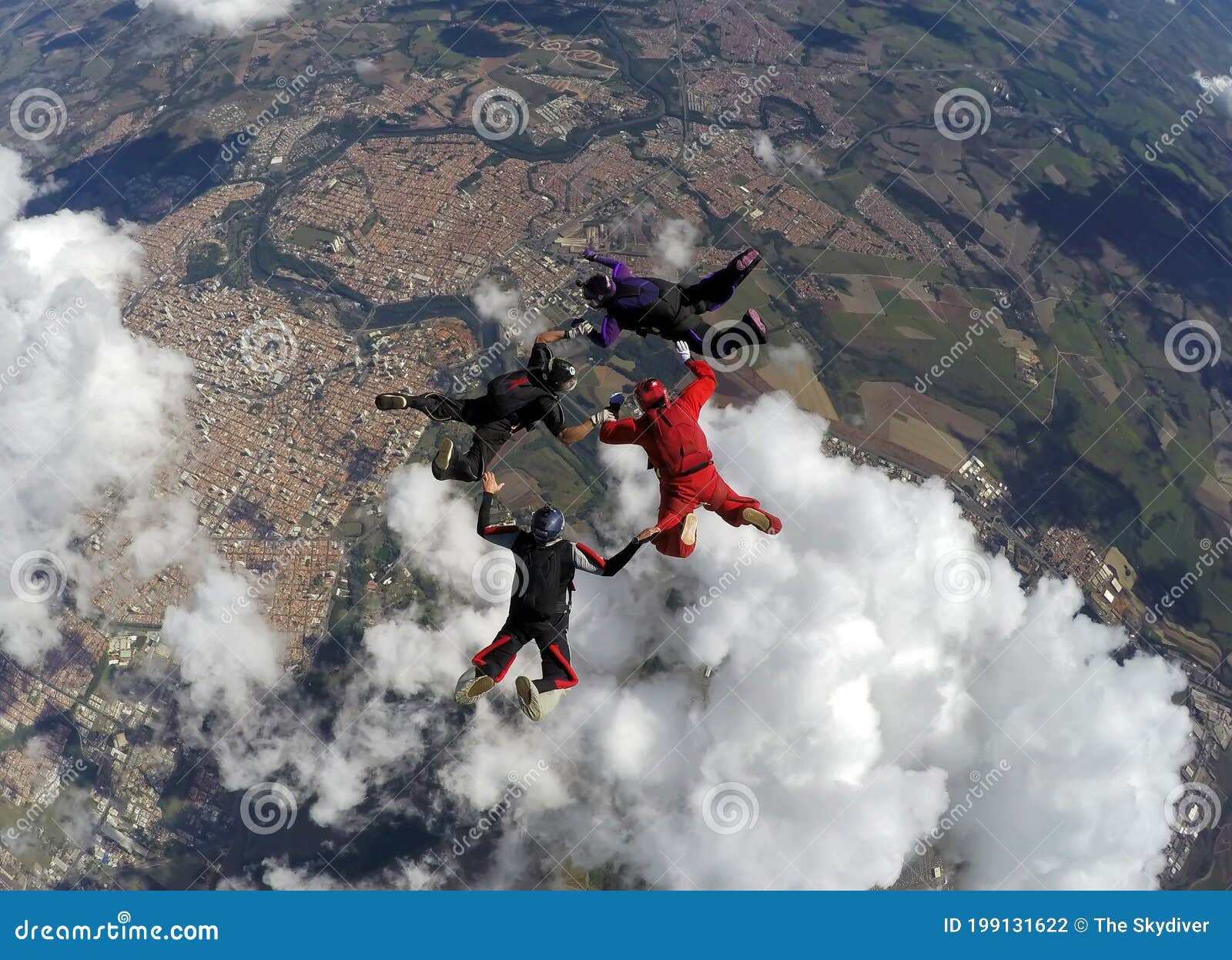Skydiving 4 Way Team Above the Clouds. Stock Photo - Image of hands ...