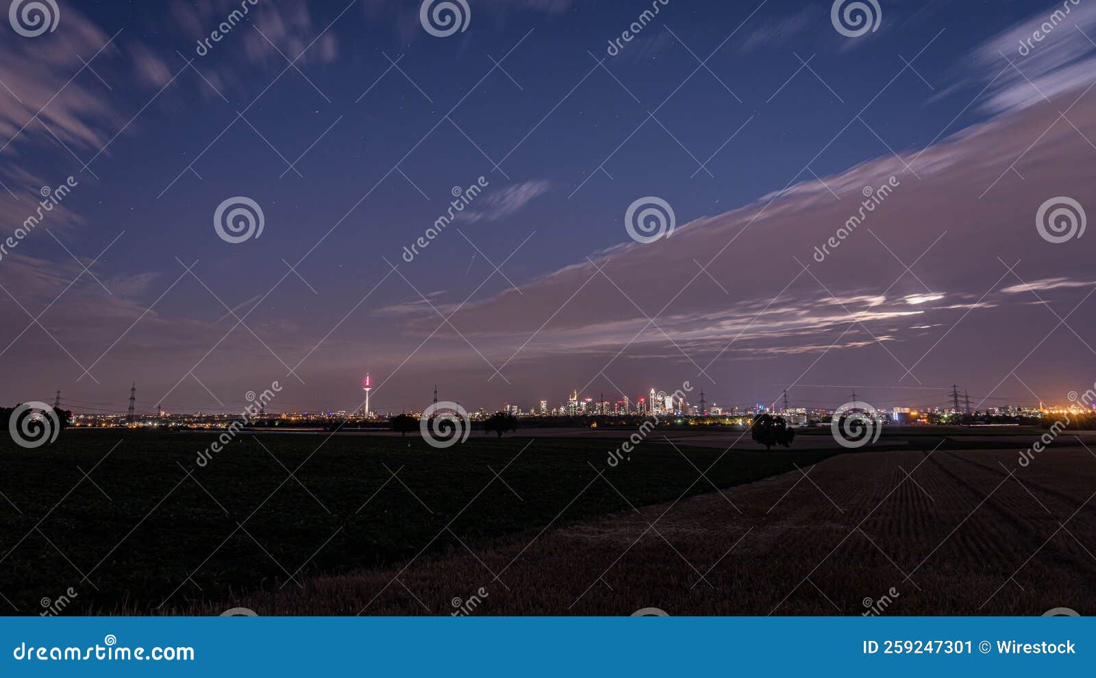 Skyline of Distant Buildings with Night Lights Captured Against a Dark ...