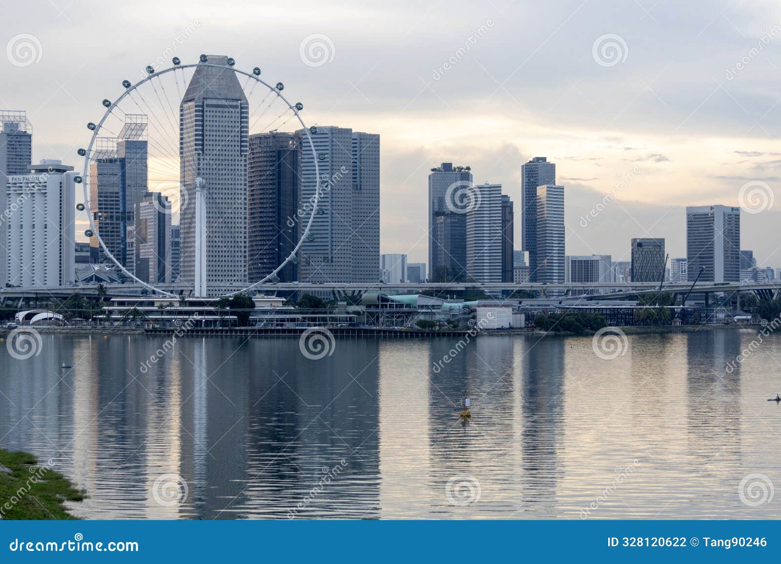 Skyline of Singapore with Famous Singapore Ferries Wheel Editorial ...