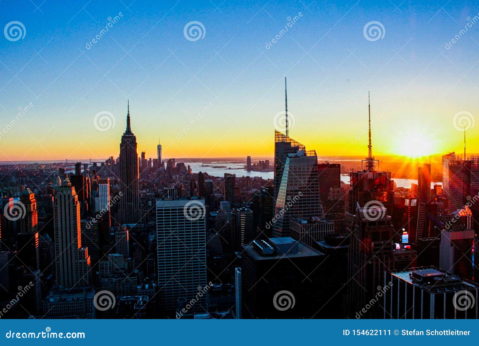 A skyline at sunset stock image. Image of metropolitan - 154622111
