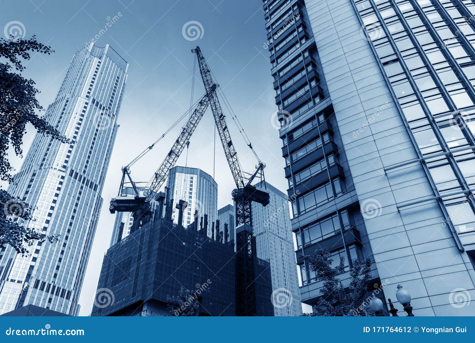 Skyscraper Construction Site Stock Photo - Image of equipment, crane ...