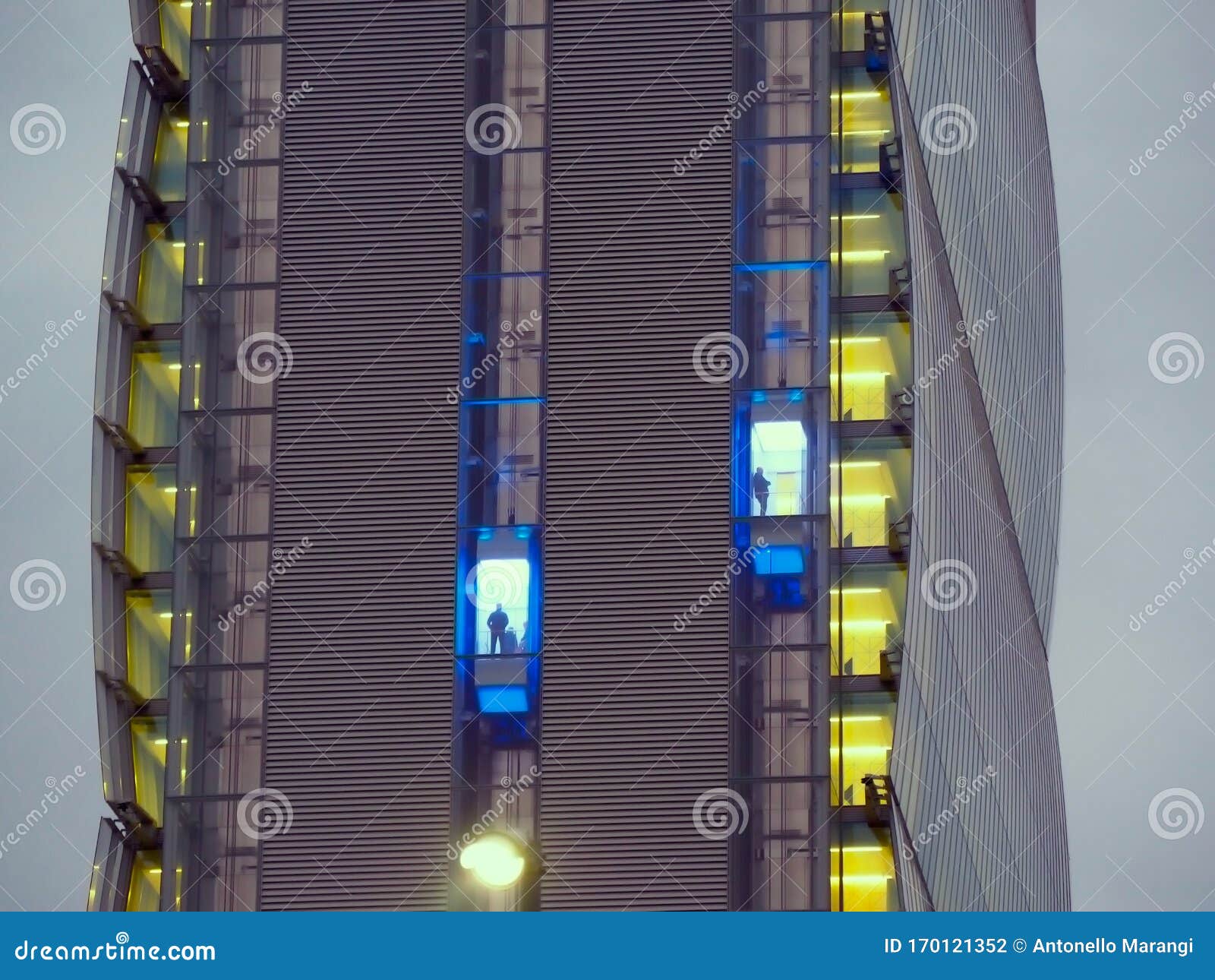 Skyscraper External Elevator with Persons Silhouette Inside Stock Photo ...