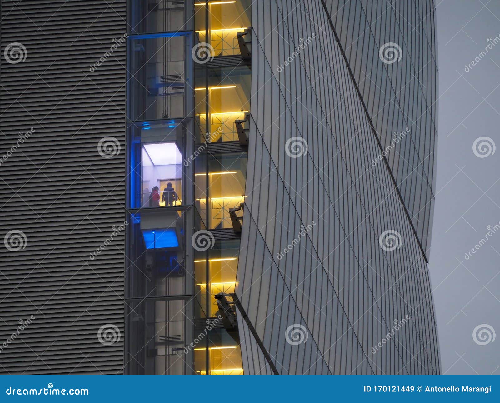 Skyscraper External Elevator with Persons Silhouette Inside Stock Image ...